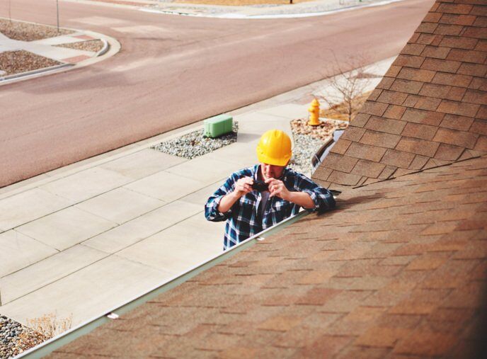 Spotting a Roof Scam: When Roofers Cause Roof Damage to Win Your Business